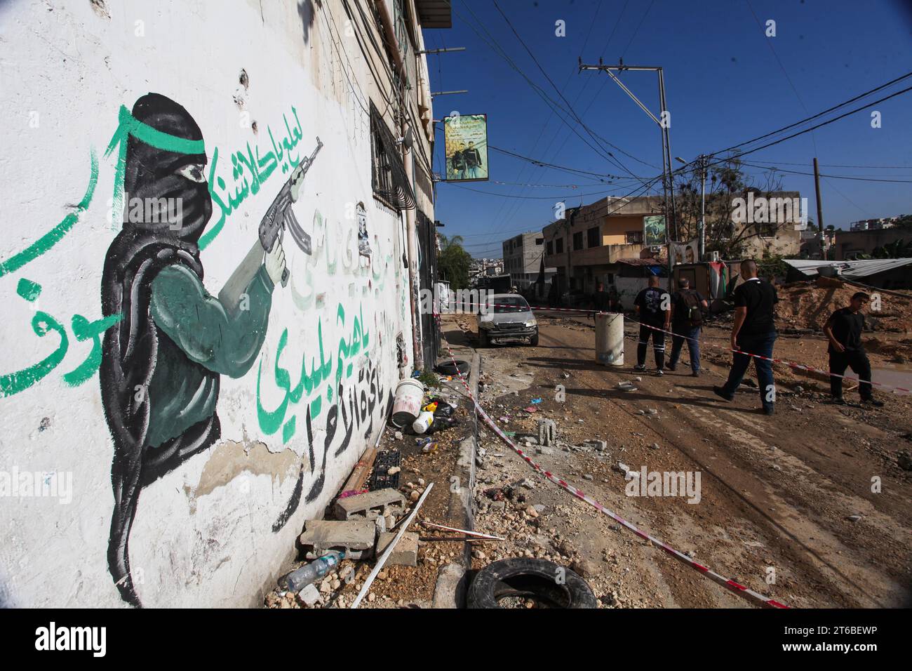 Tulkarm, Palestine. 08th Nov, 2023. Palestinians walk through a ...