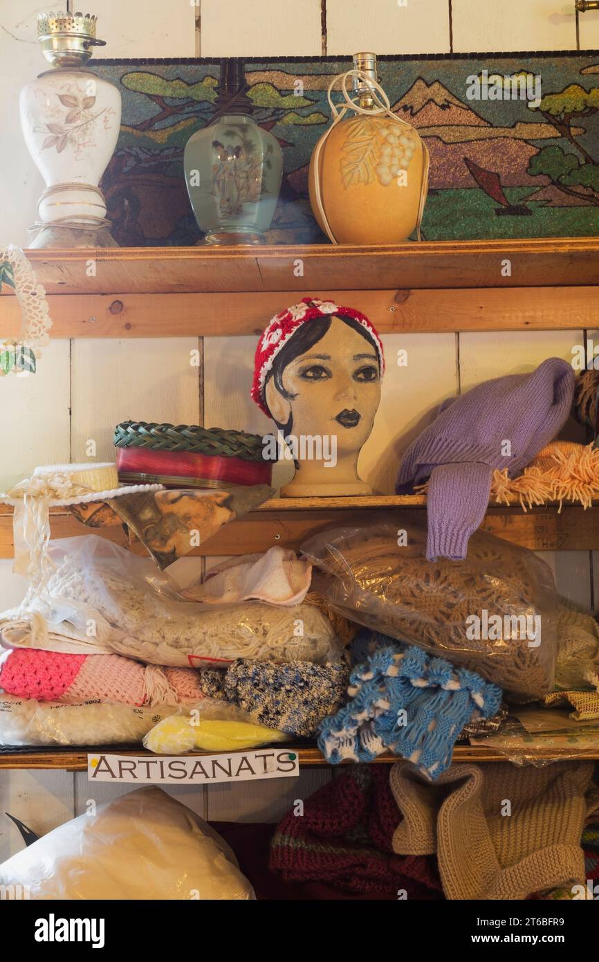 Crocheted fabric items and mannequin head for sale inside second hand ...