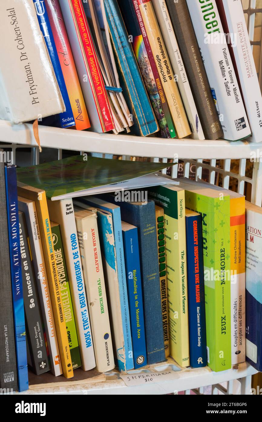Various books displayed in bookcase for sale inside second hand goods ...