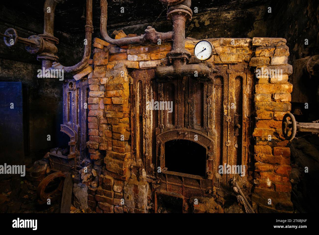 Old rusty stove in abandoned boiler room Stock Photo - Alamy