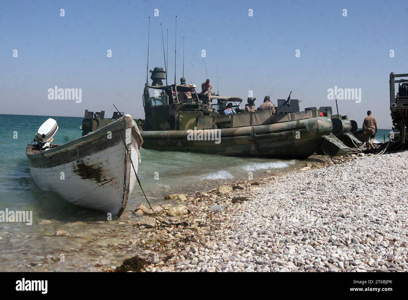 USN patrol vessel and captures at Haditha Dam Stock Photo - Alamy