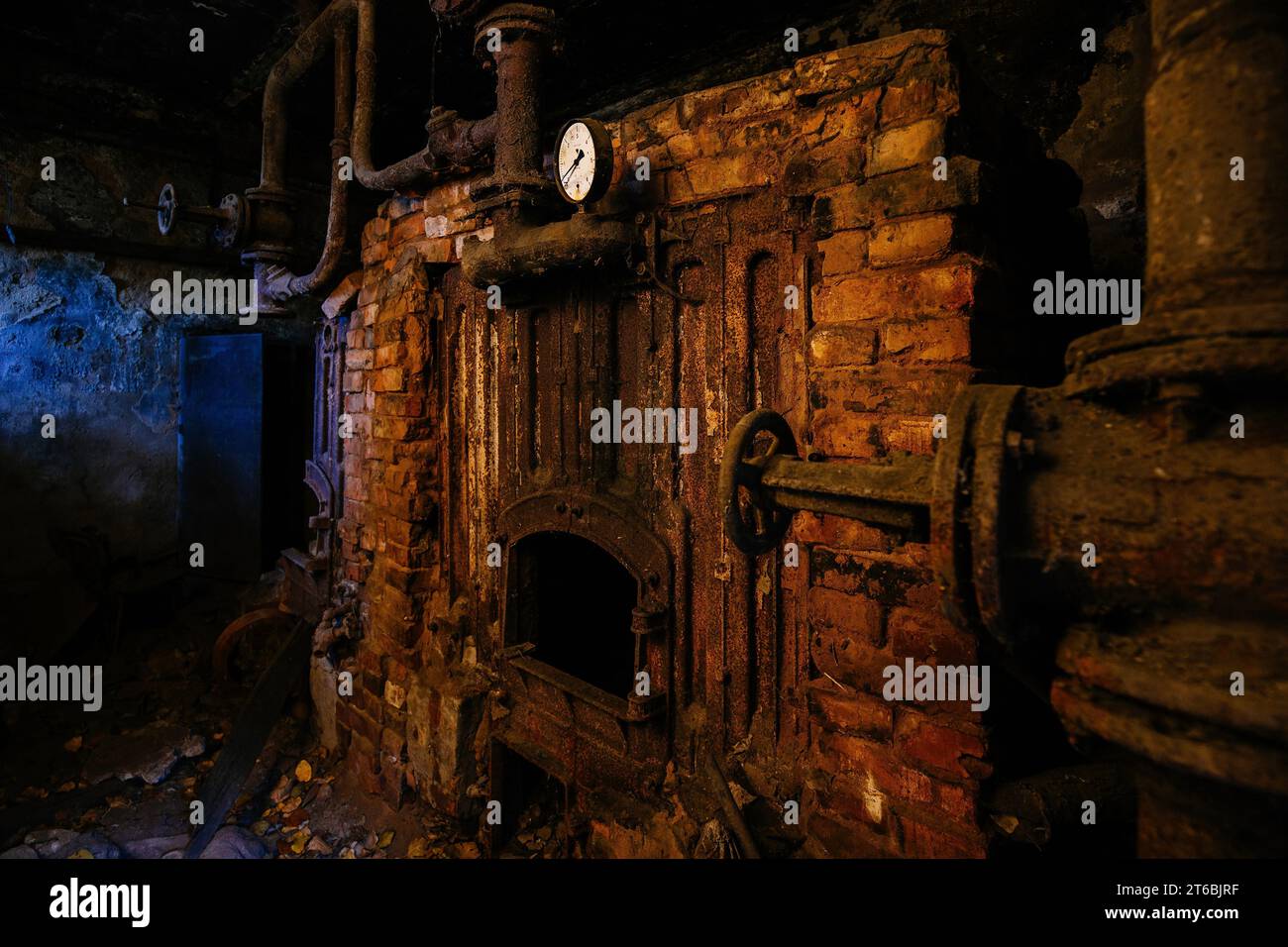 Old rusty stove in abandoned boiler room Stock Photo - Alamy