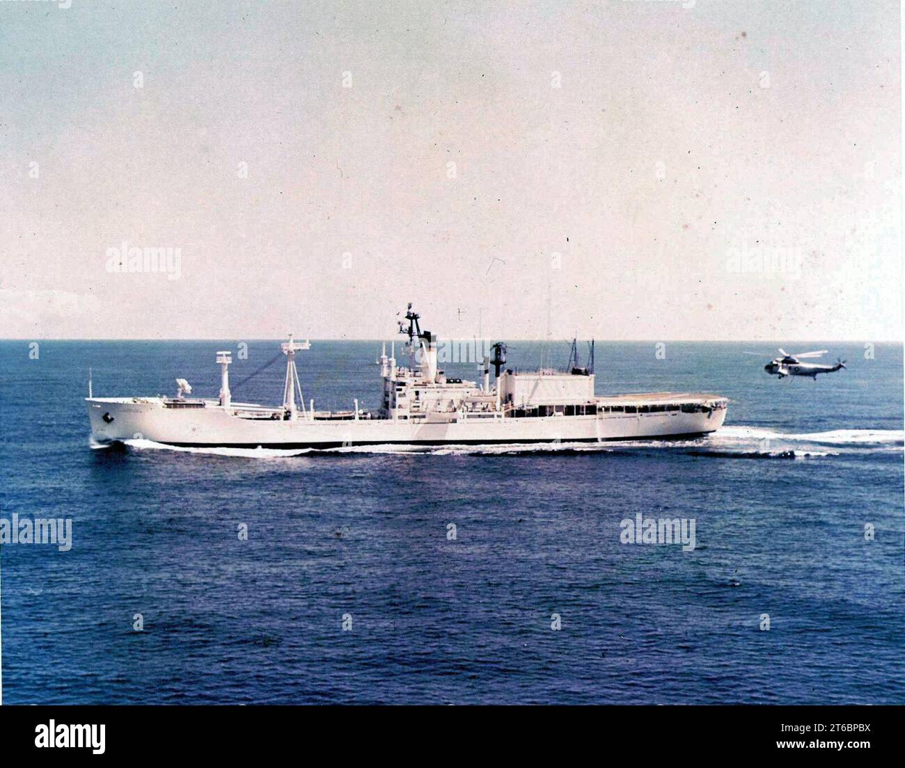 USNS Longview underway with USAF Sea King near Hawaii in 1966 Stock ...