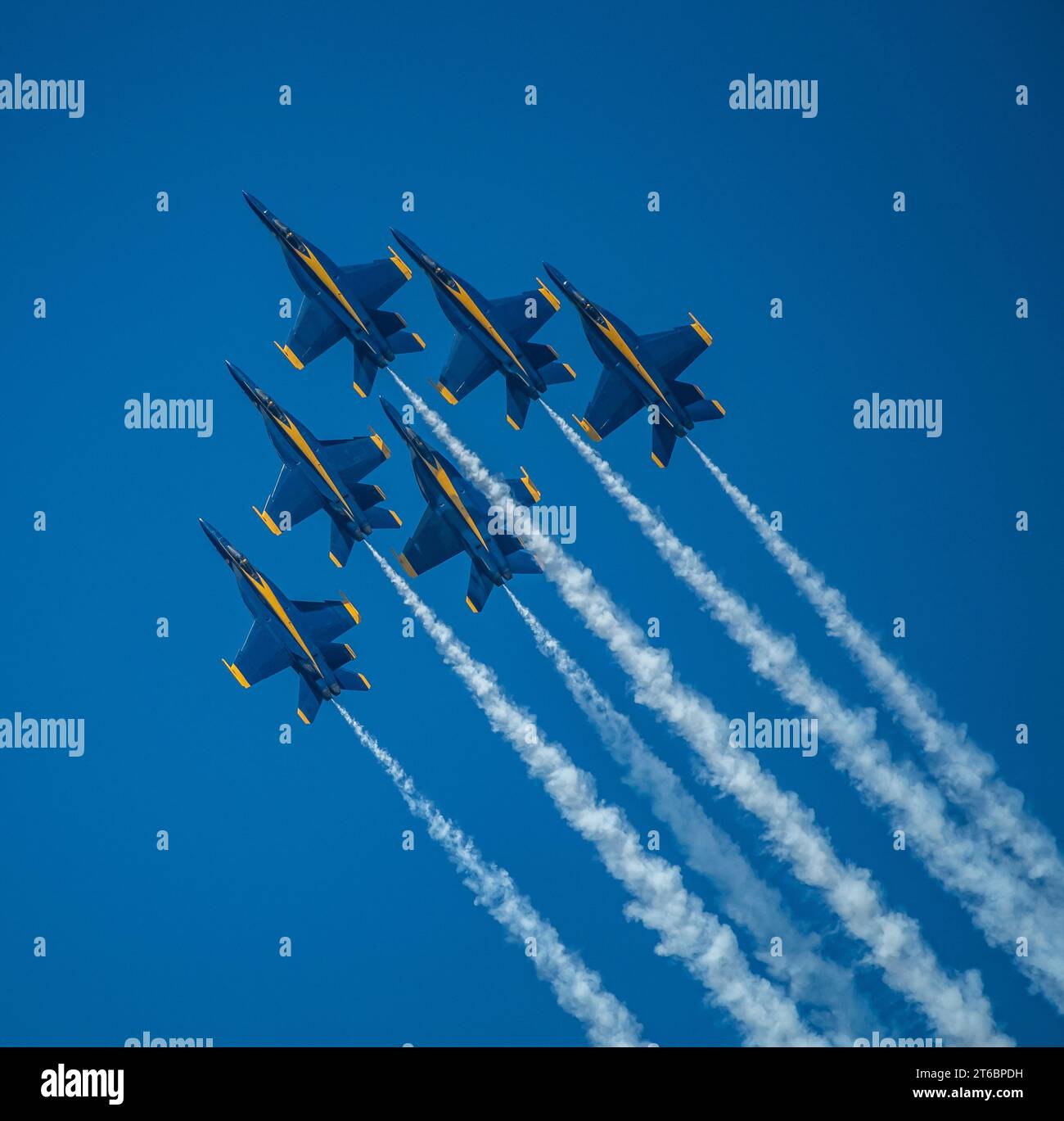 A squadron of fighter jets soaring through the sky in unison, creating ...