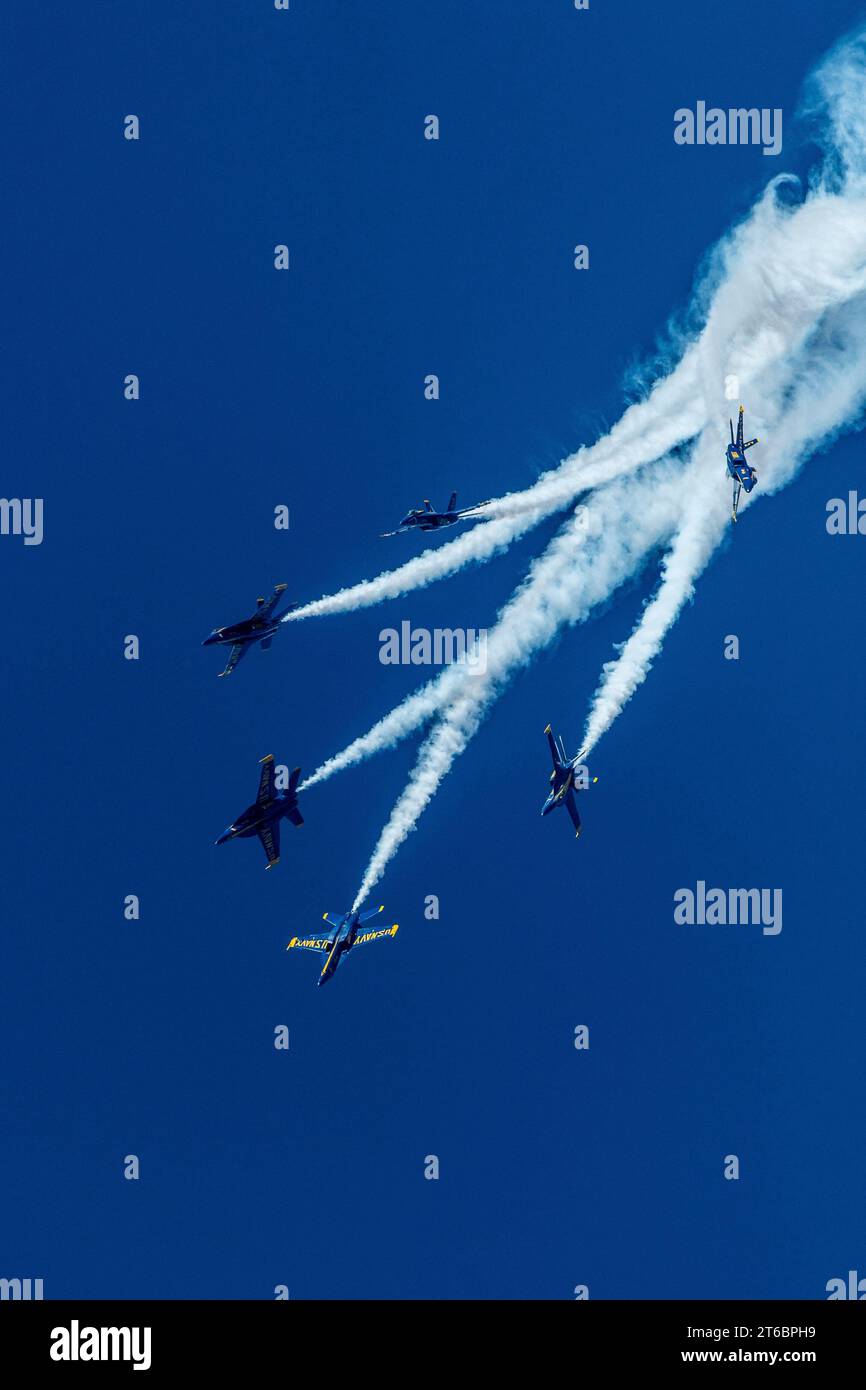 A stunning aerial view of four planes soaring in the sky creating an ...