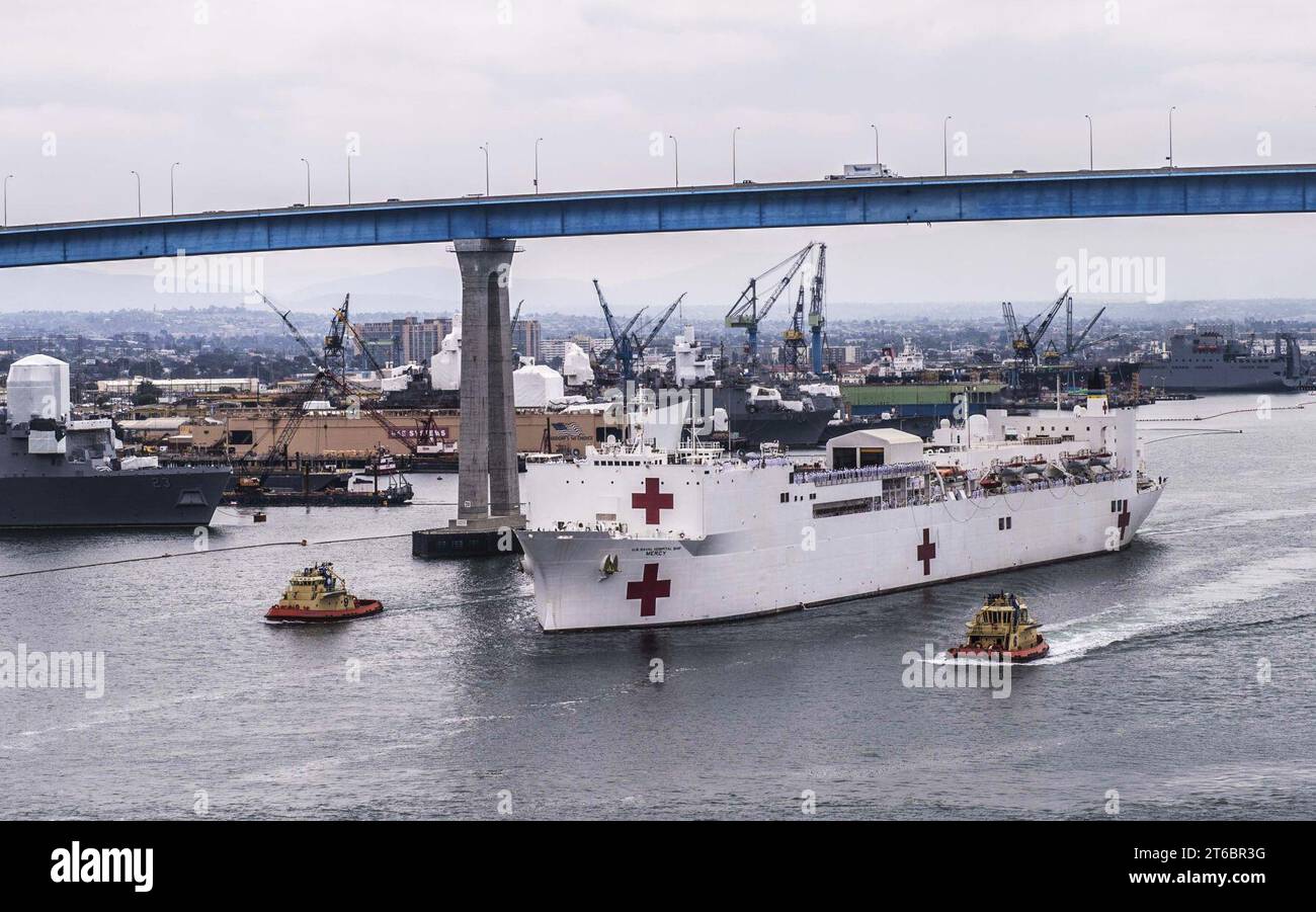 USNS Mercy passes underneath the Coronado Bridge as it departs Naval ...