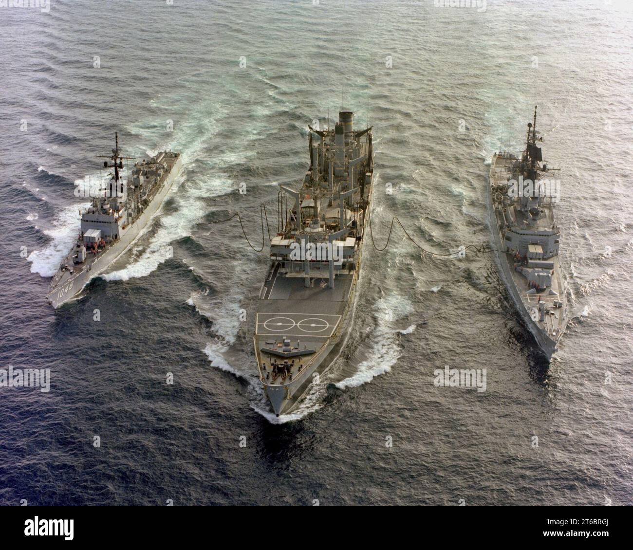 USNS Mispillion (T-AO-105) refueling USS Leahy (CG-16) and USS Sample ...