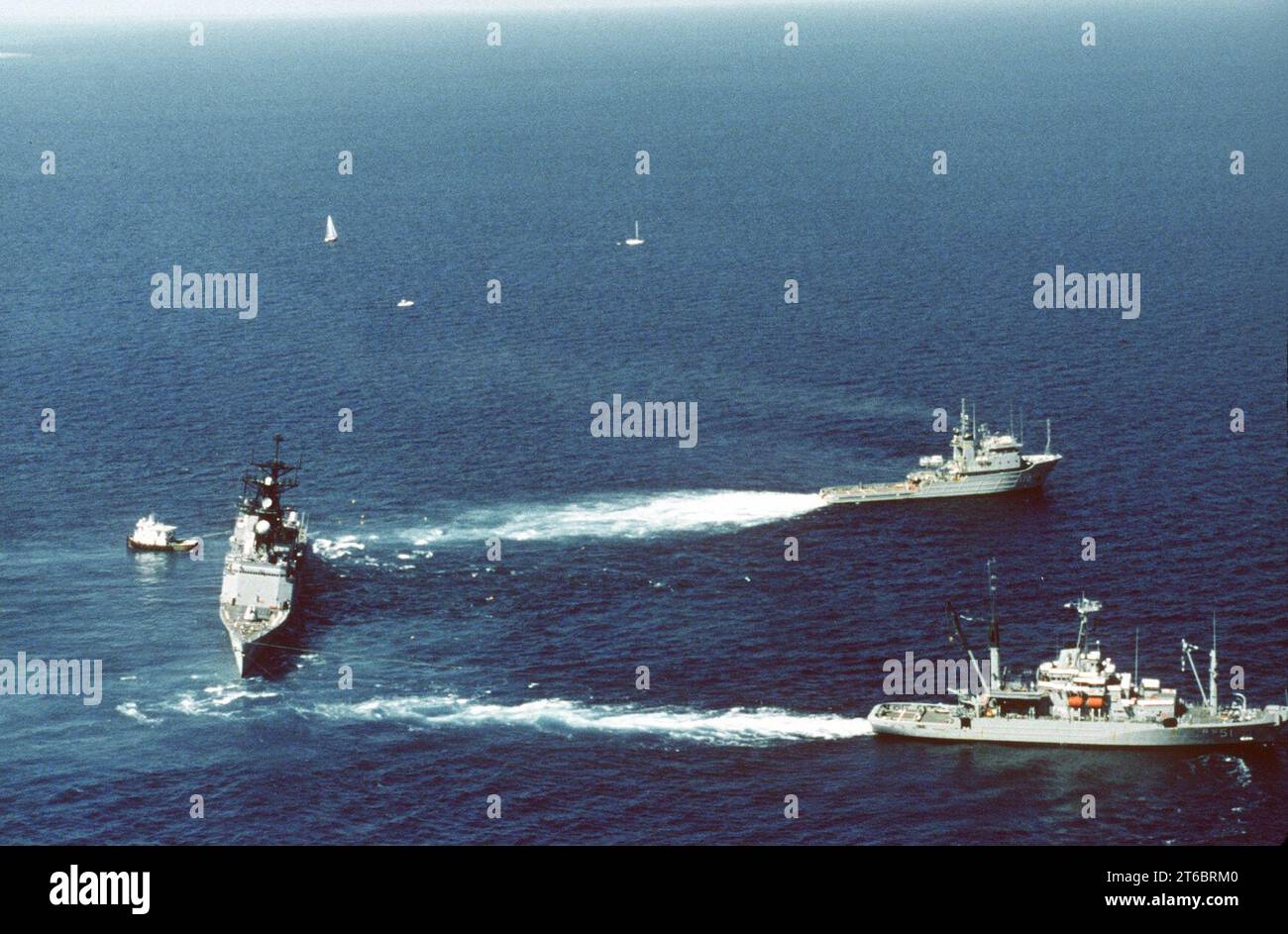 USNS Mohawk and USS Grasp pull USS Spruance off a coral reef in the ...