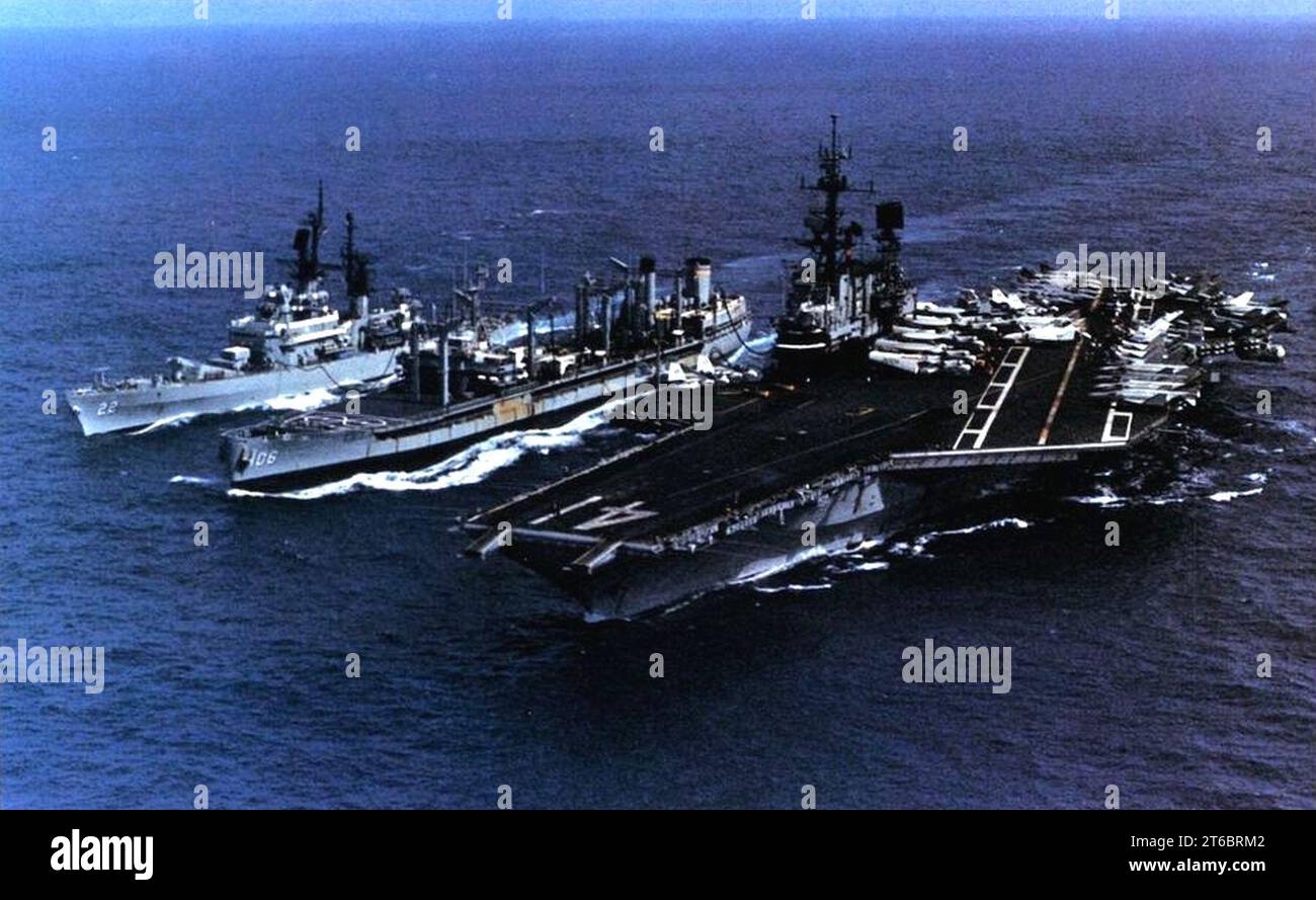 USNS Navasota (T-AO-106) refuels USS Midway (CV-41) and USS England (CG ...