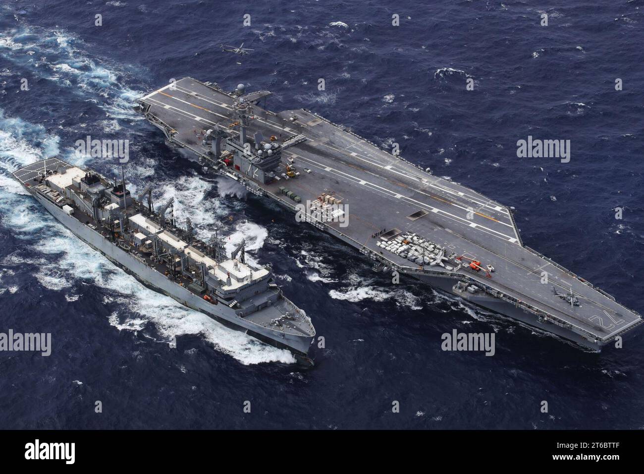 USNS Supply (T-AOE-6) replenishes USS Abraham Lincoln (CVN-72) in the ...