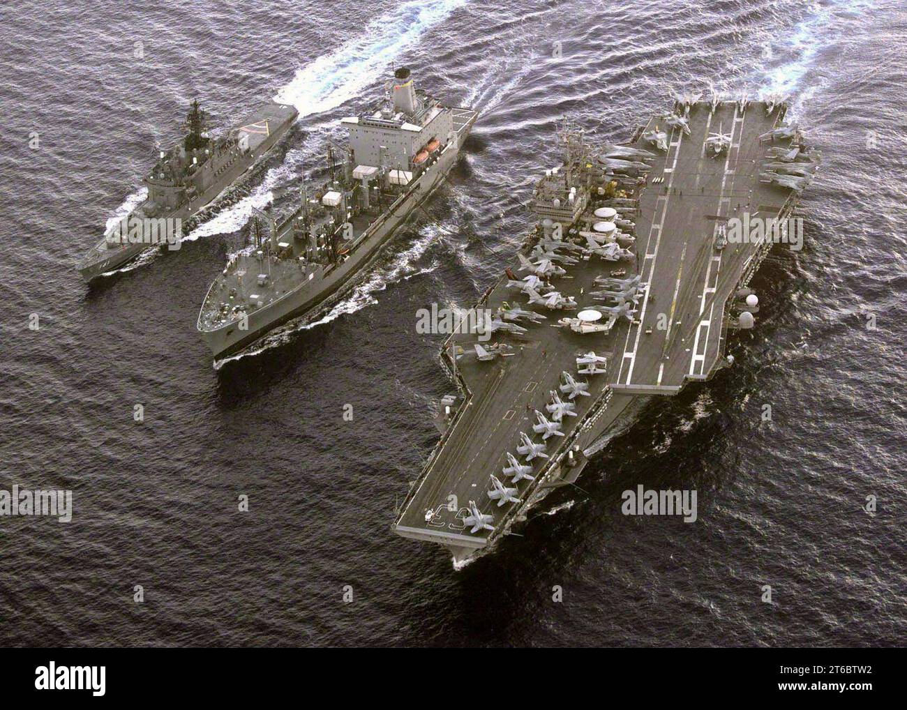 USNS Tippecanoe (T-AO-199) underway replenishment with USS Kittyhawk (CV-63) and Haruna (DD141 ...