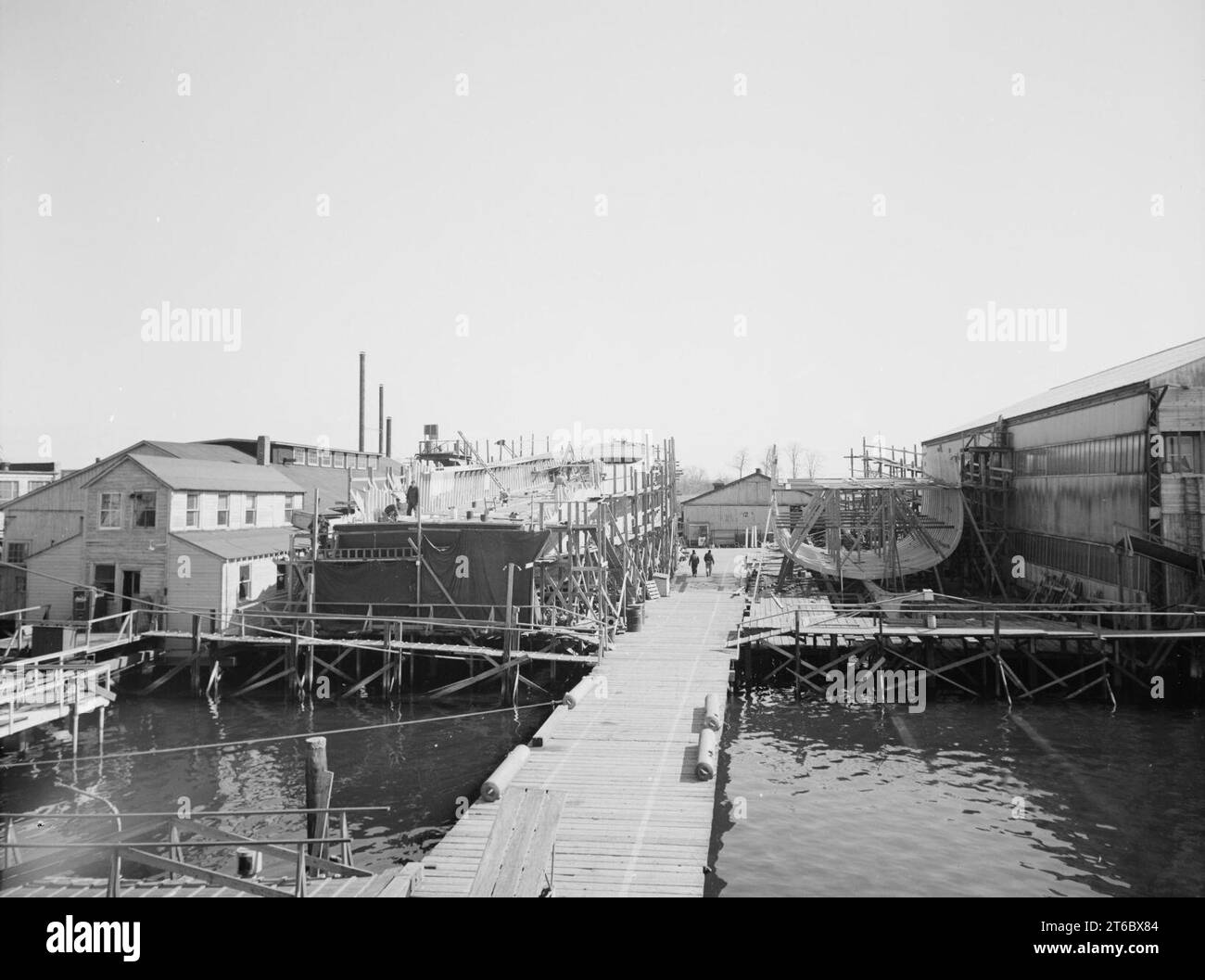 USS Agile (MSO-421) and USS Salute (MSO-470) under construction in 1954 ...