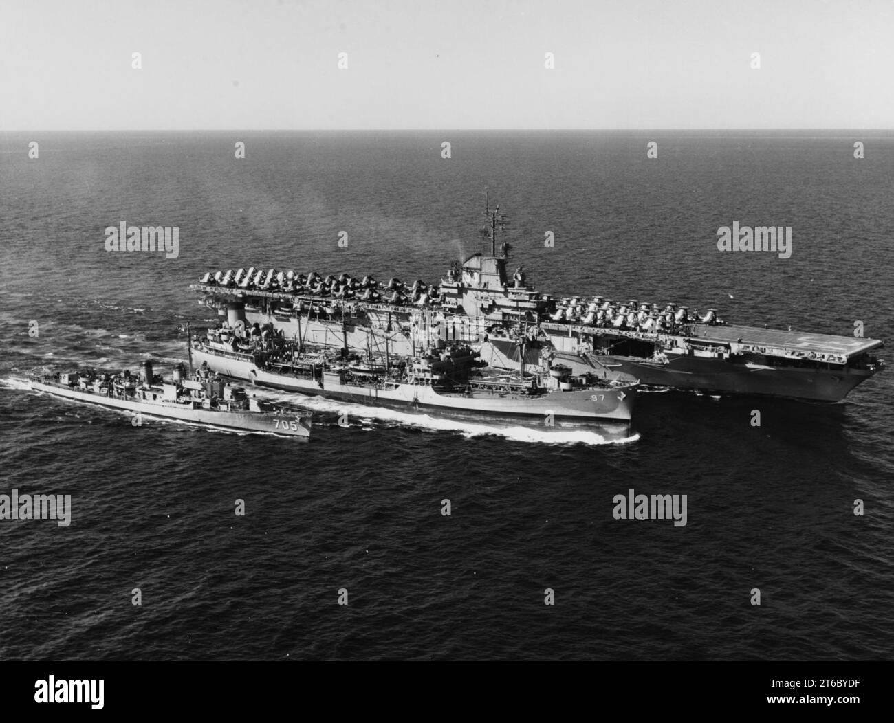 USS Allagash (AO-97) refueling USS Oriskany (CVA-34) and USS Compton ...