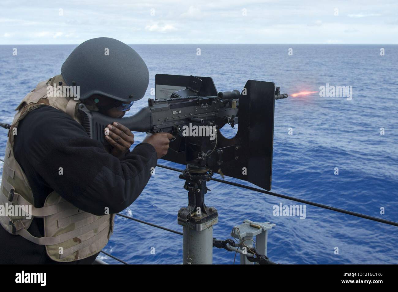 USS Anchorage (LPD-23) sailor firing M240 machine gun during weapons ...