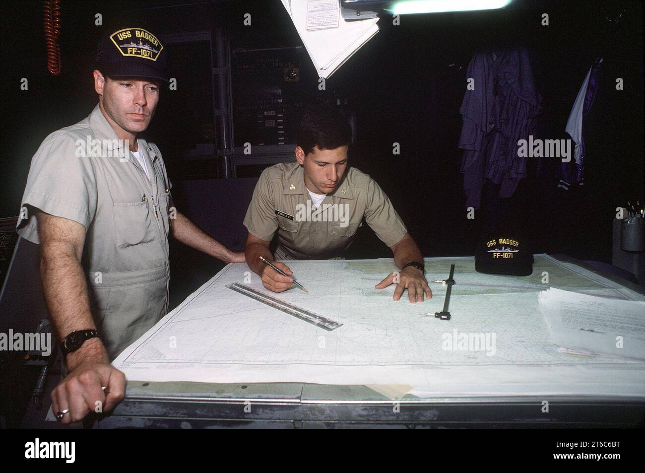 USS Badger (FF-1071) crew plotting course Stock Photo - Alamy