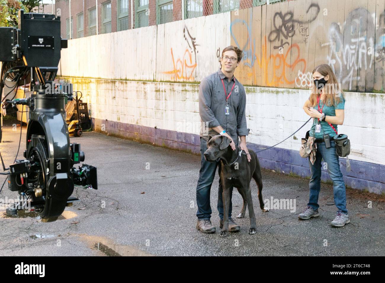 STRAYS, director Josh Greenbaum (left), with Hunter, on set, 2023. ph ...