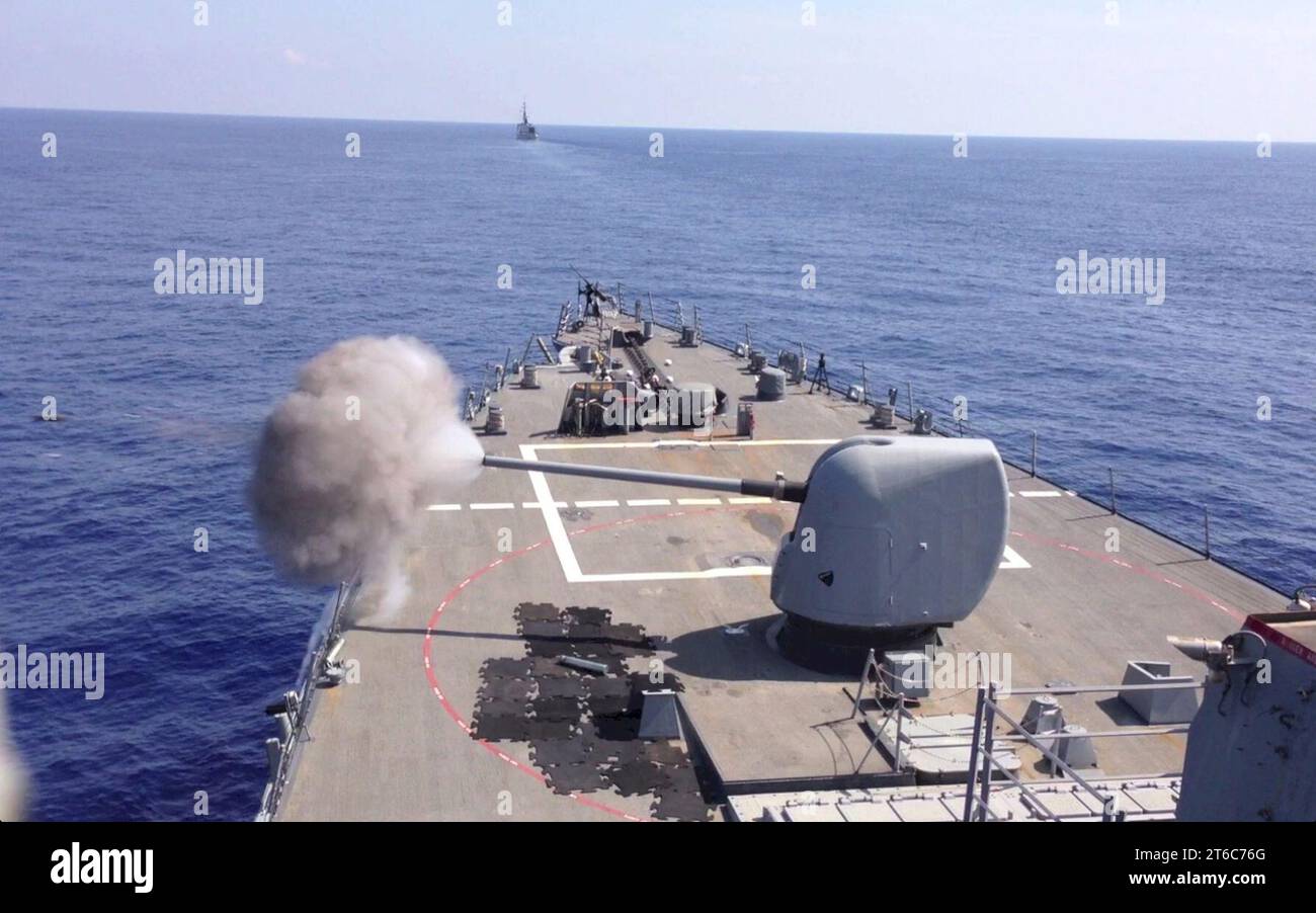 USS Barry fires its deck gun. (8788920088 Stock Photo - Alamy