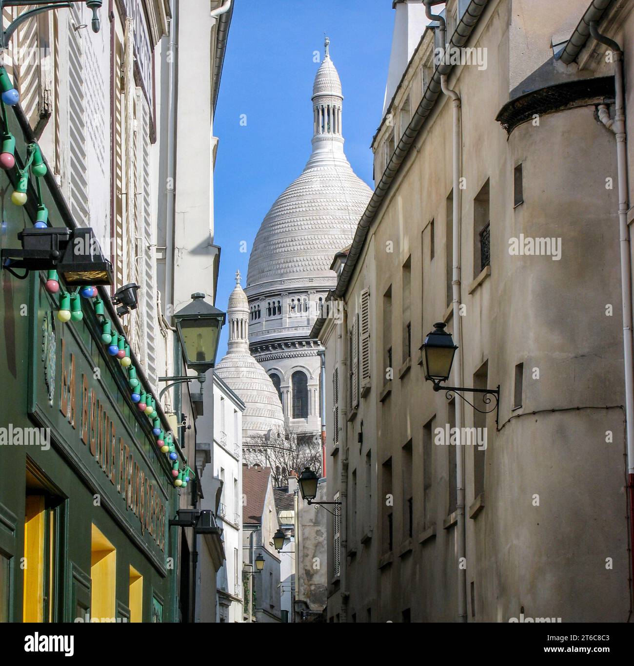 The white domes of Sacre-Cooeur tower over the neighborhood of ...