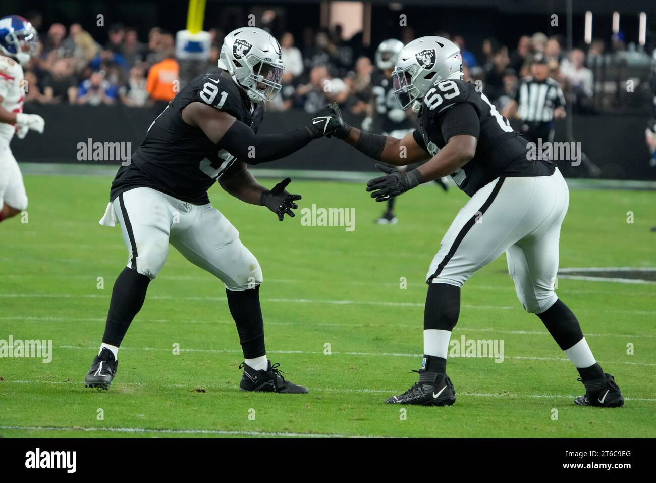 Las Vegas Raiders defensive tackle Bilal Nichols (91) and defensive ...
