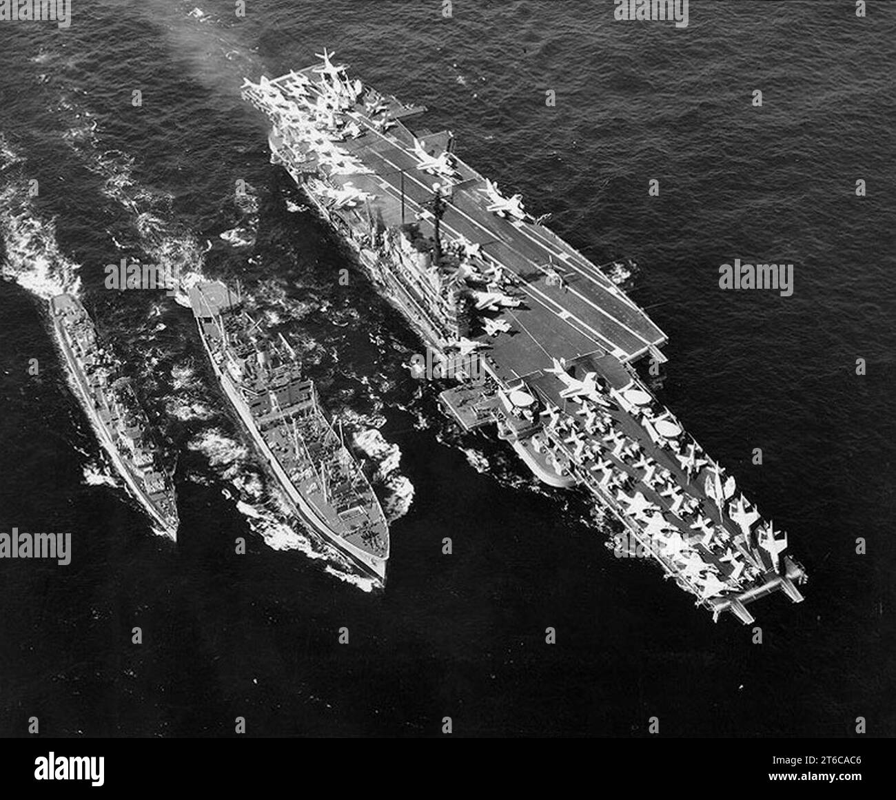 USS Bellatrix (AF-62) replenishes USS Coral Sea (CVA-43) and USS Duncan ...