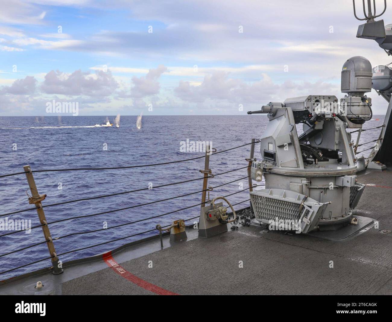 USS Benfold (DDG 65) fires its Mark 38 25mm gun as part of a live-fire ...