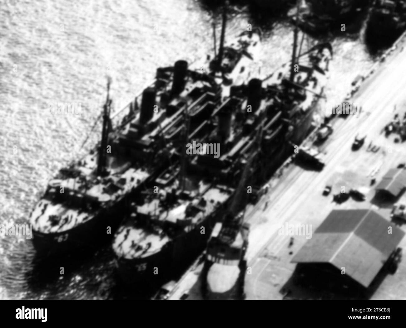 USS Bladen (APA-63) and USS Briscoe (APA-65) docked at the Pearl Harbor ...