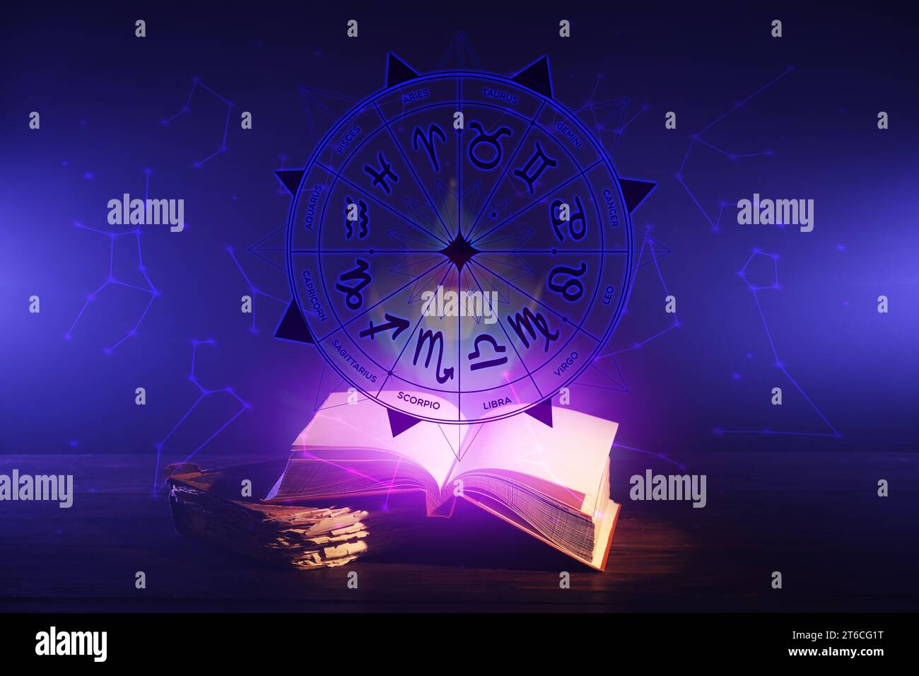 Old astrology books on table against dark blue background Stock Photo ...