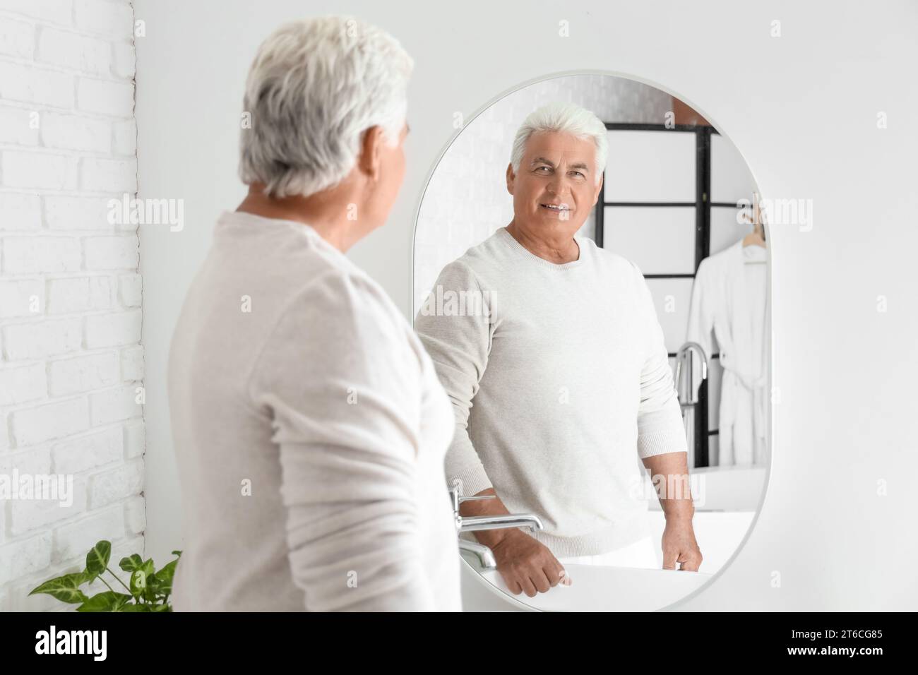 Senior man in front mirror hi-res stock photography and images - Alamy