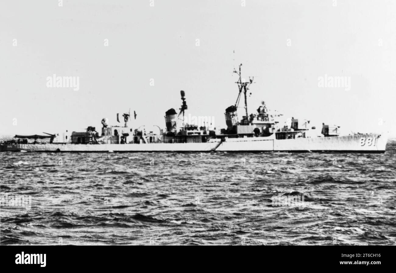 USS Bordelon (DDR-881) at anchor, circa the later 1950s or early 1960s ...