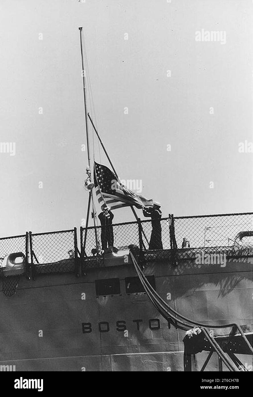 USS Boston (CA-69) lowering flag Stock Photo - Alamy