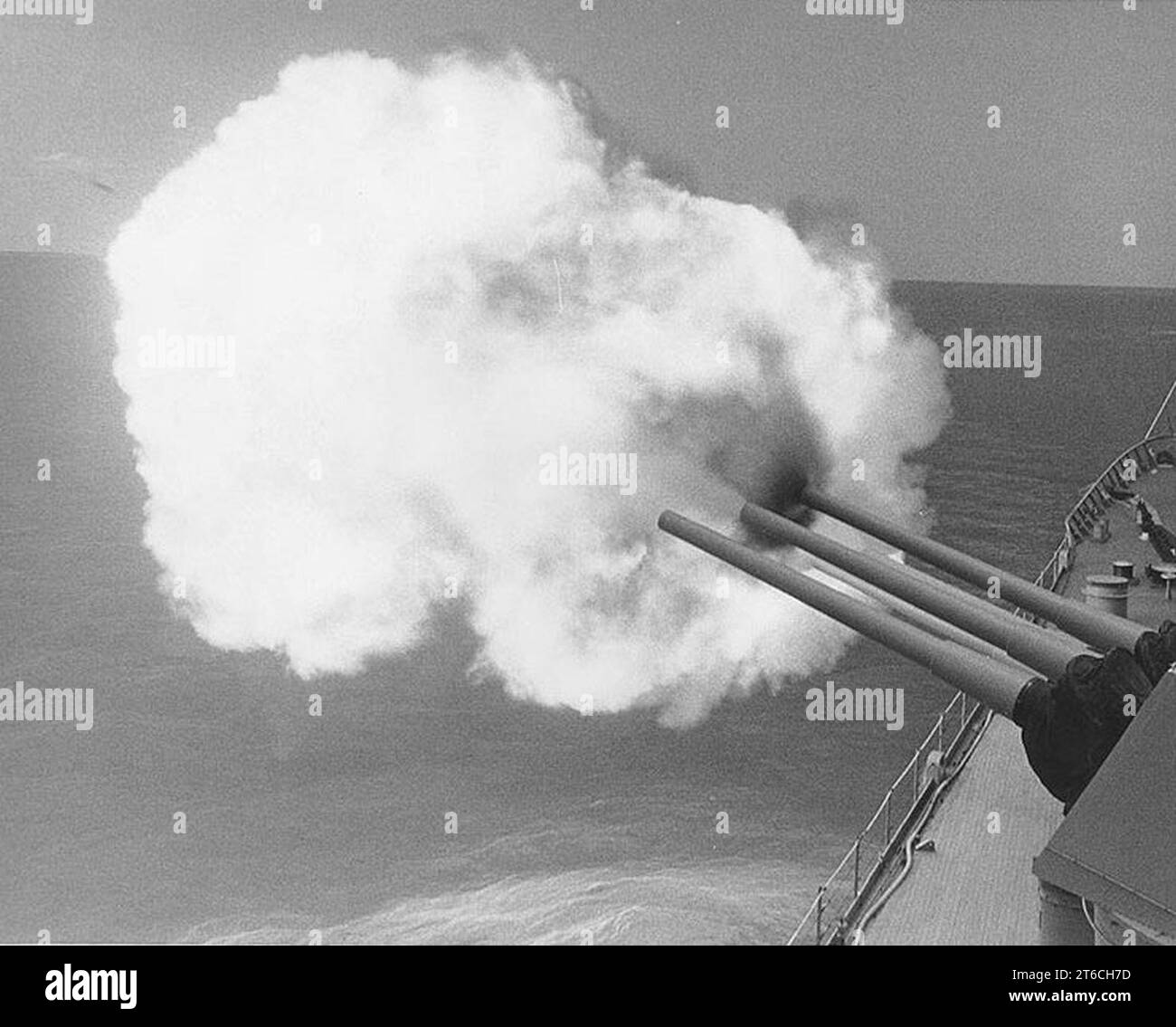 USS Boston (CA-69) fires a salvo at enemy positions in Vietnam, in 1969 ...