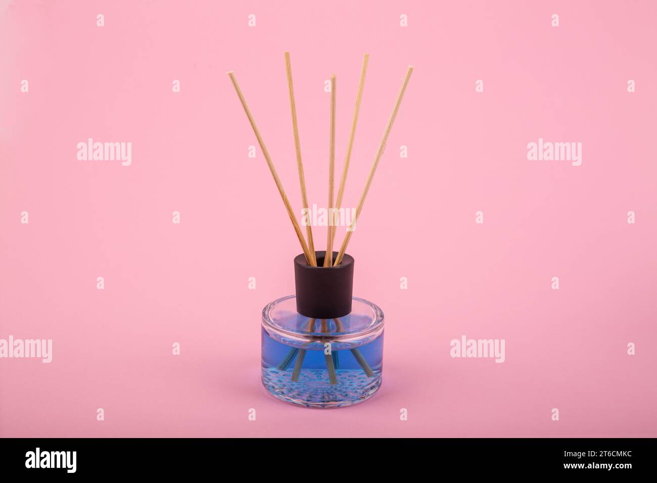 Scent sticks in the glass on the pink background Stock Photo - Alamy