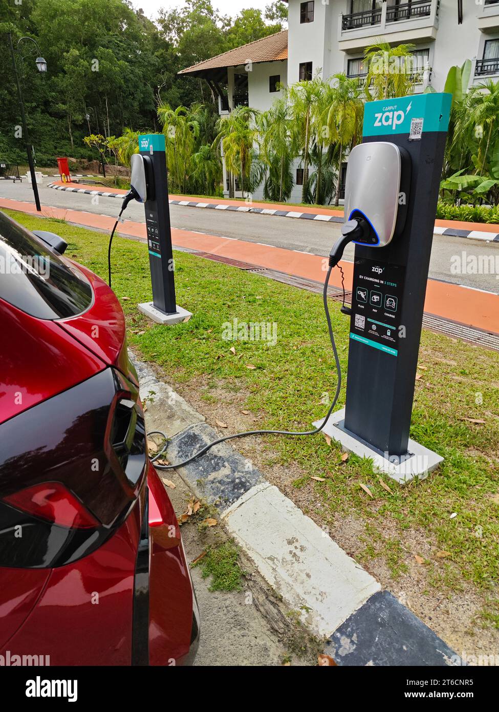 Scene of cars using EV charging point or station at the resort parking ...