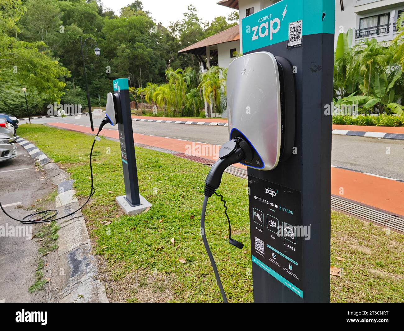 Scene of cars using EV charging point or station at the resort parking ...