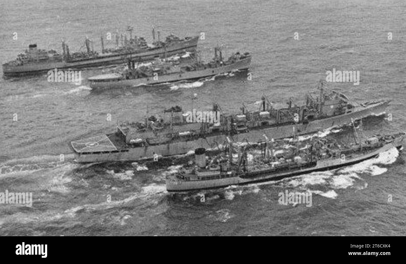 USS Camden (AOE-2) underway with other auxiliaries in 1970 Stock Photo ...