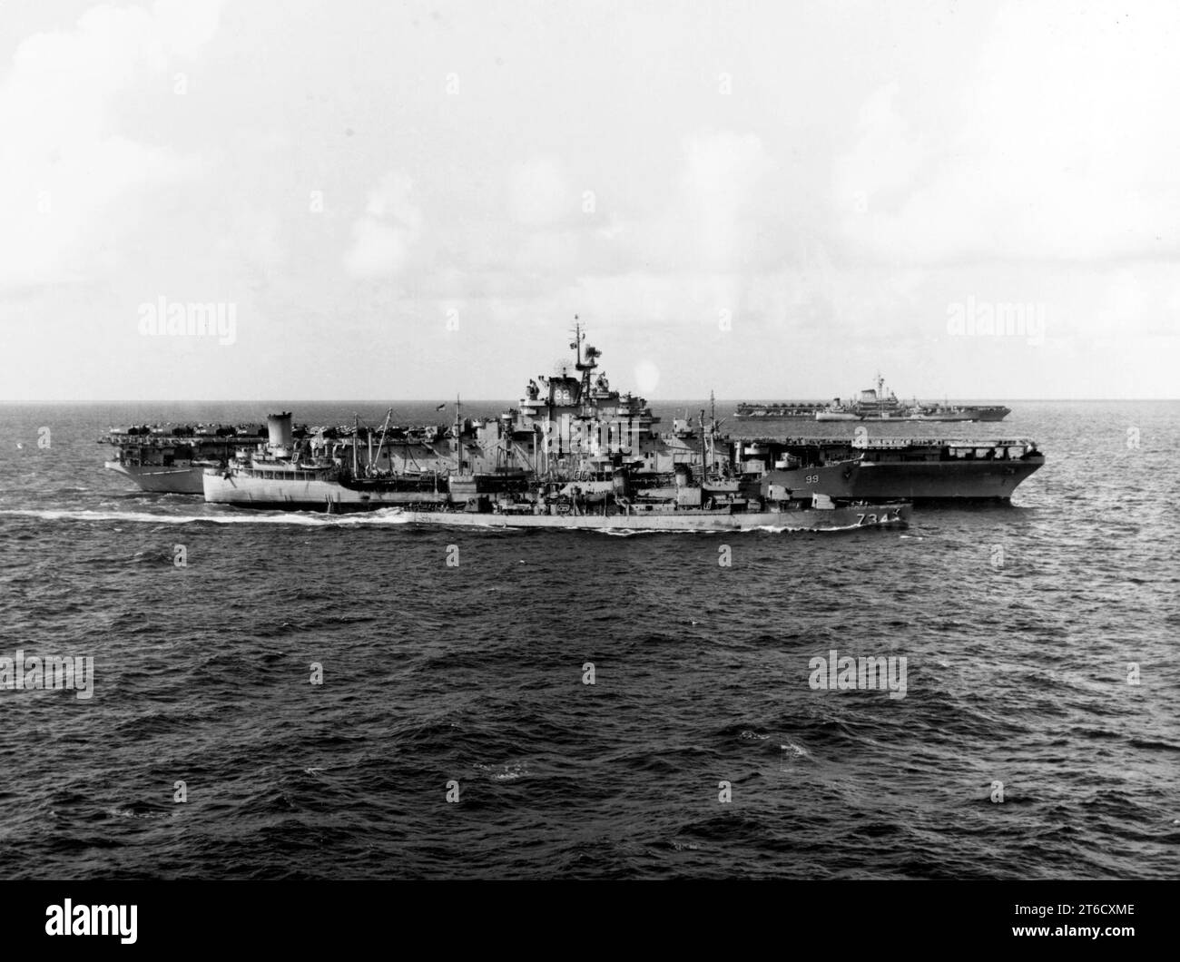 USS Canisteo (AO-99) refuels USS Leyte (CV-32) and USS Purdy (DD-734 ...