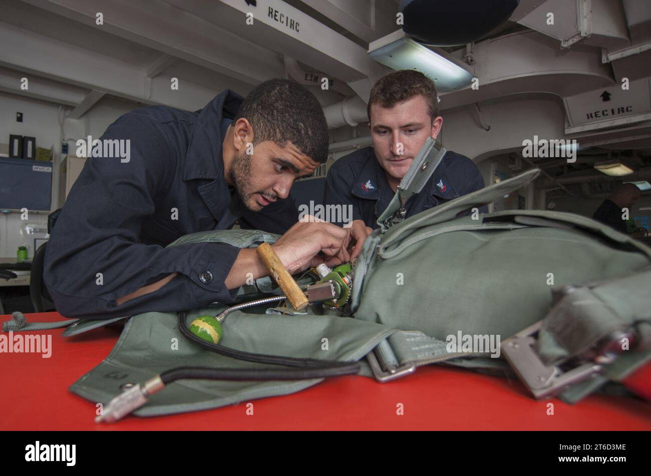 USS Carl Vinson Sailors conduct parachute maintenance 141111 Stock ...