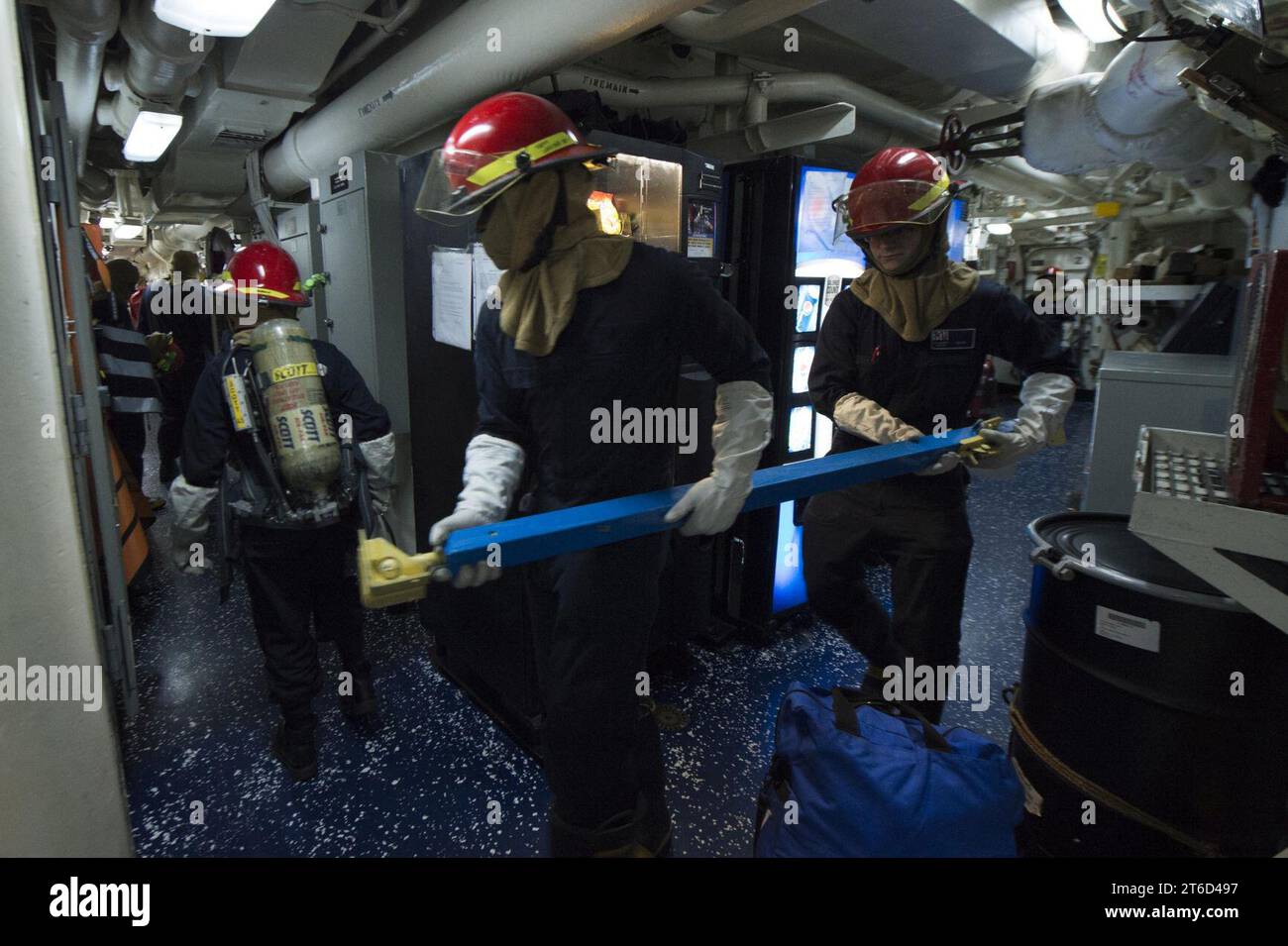 USS Carney conducts a simulated hull breach during a damage control ...