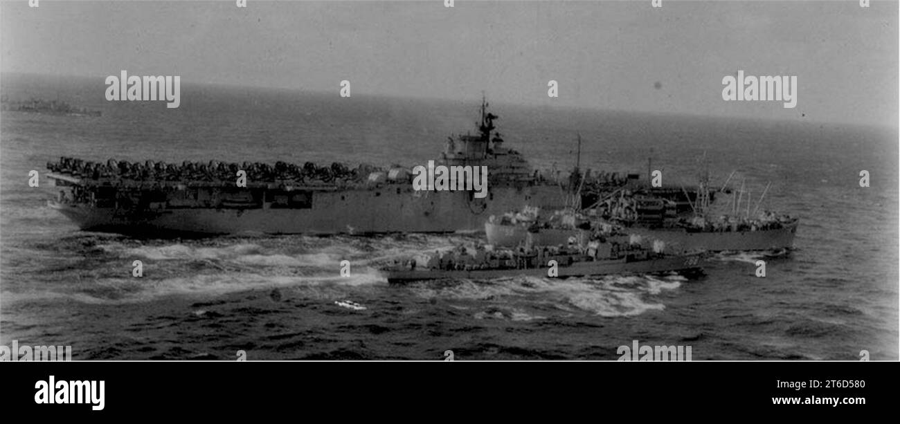 USS Chara (AKA-58) replenishing USS Philippine Sea (CV-47) and USS ...