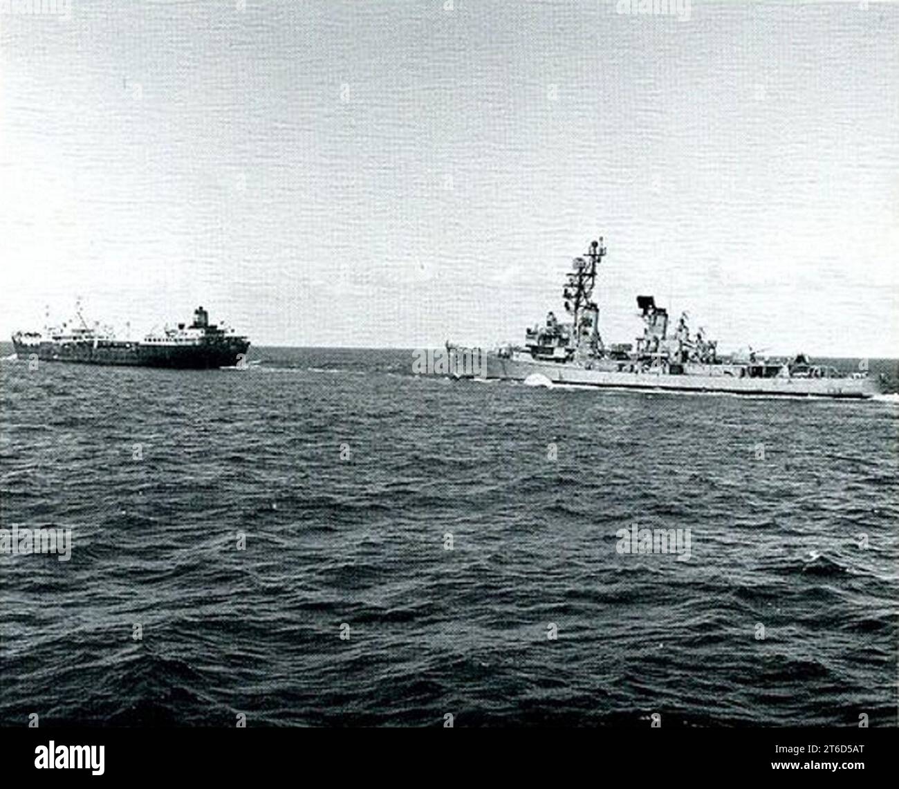 USS Charles F. Adams (DDG-2) is refueled from astern by a civilan ...