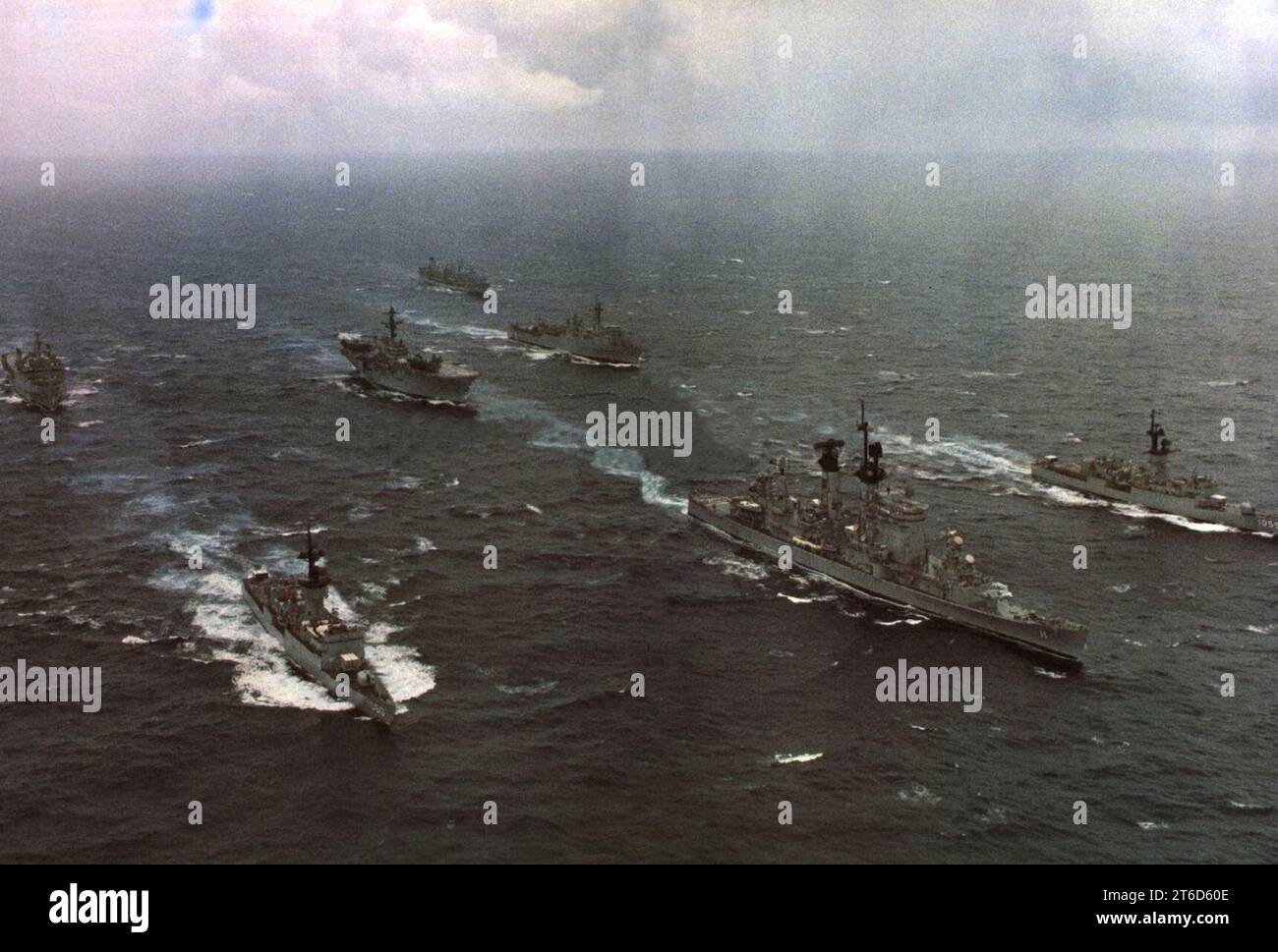 USS Chicago (CG-11) underway in the Pacific Ocean with an amphibious ...