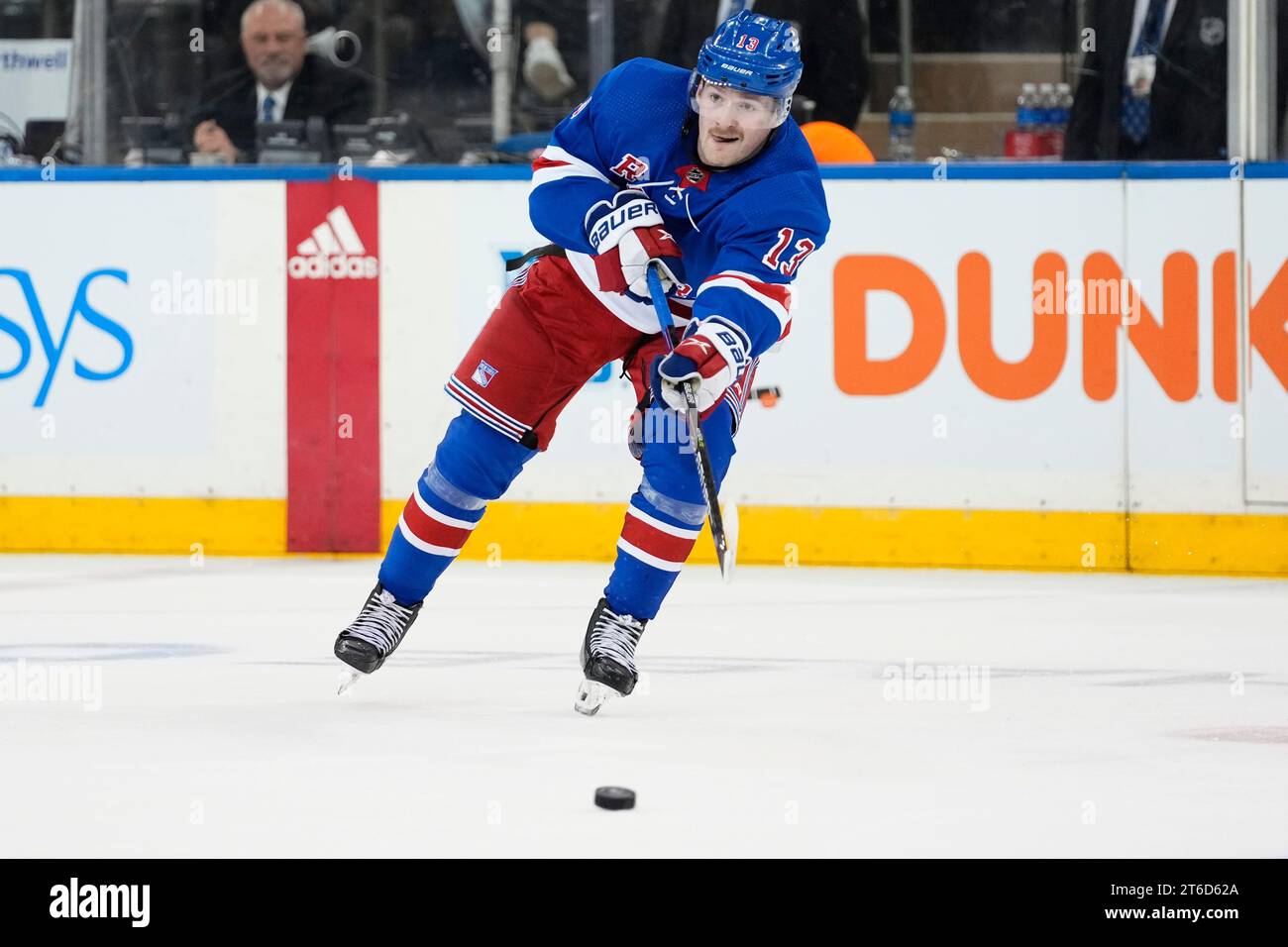 New York Rangers' Alexis Lafreniere passes to a teammate during the ...