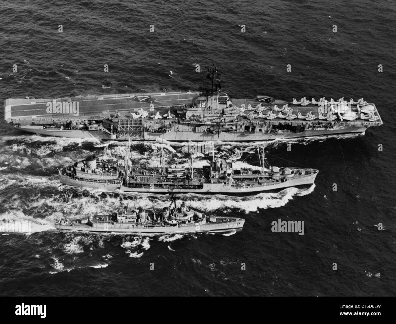 USS Cimarron (AO-22) replenishes USS Hornet (CV-12) and USS Nicholas ...