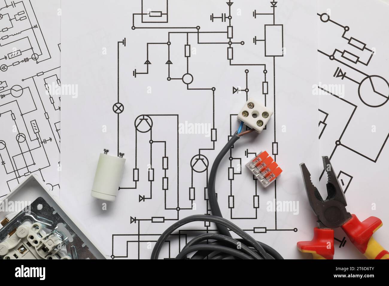 Wires, pliers and disassembled light switch on wiring diagrams, flat ...