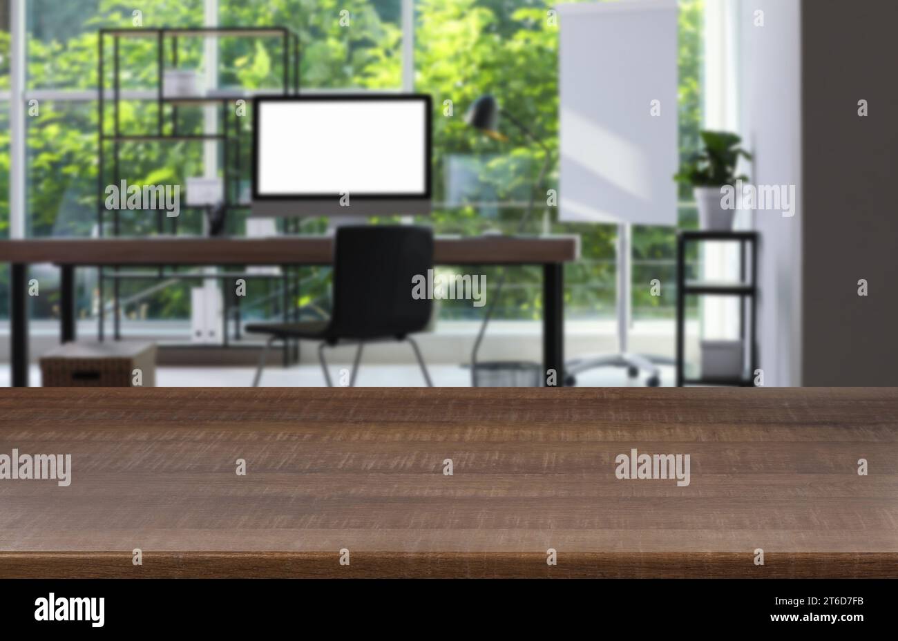Empty wooden table in comfortable office. Space for design Stock Photo ...