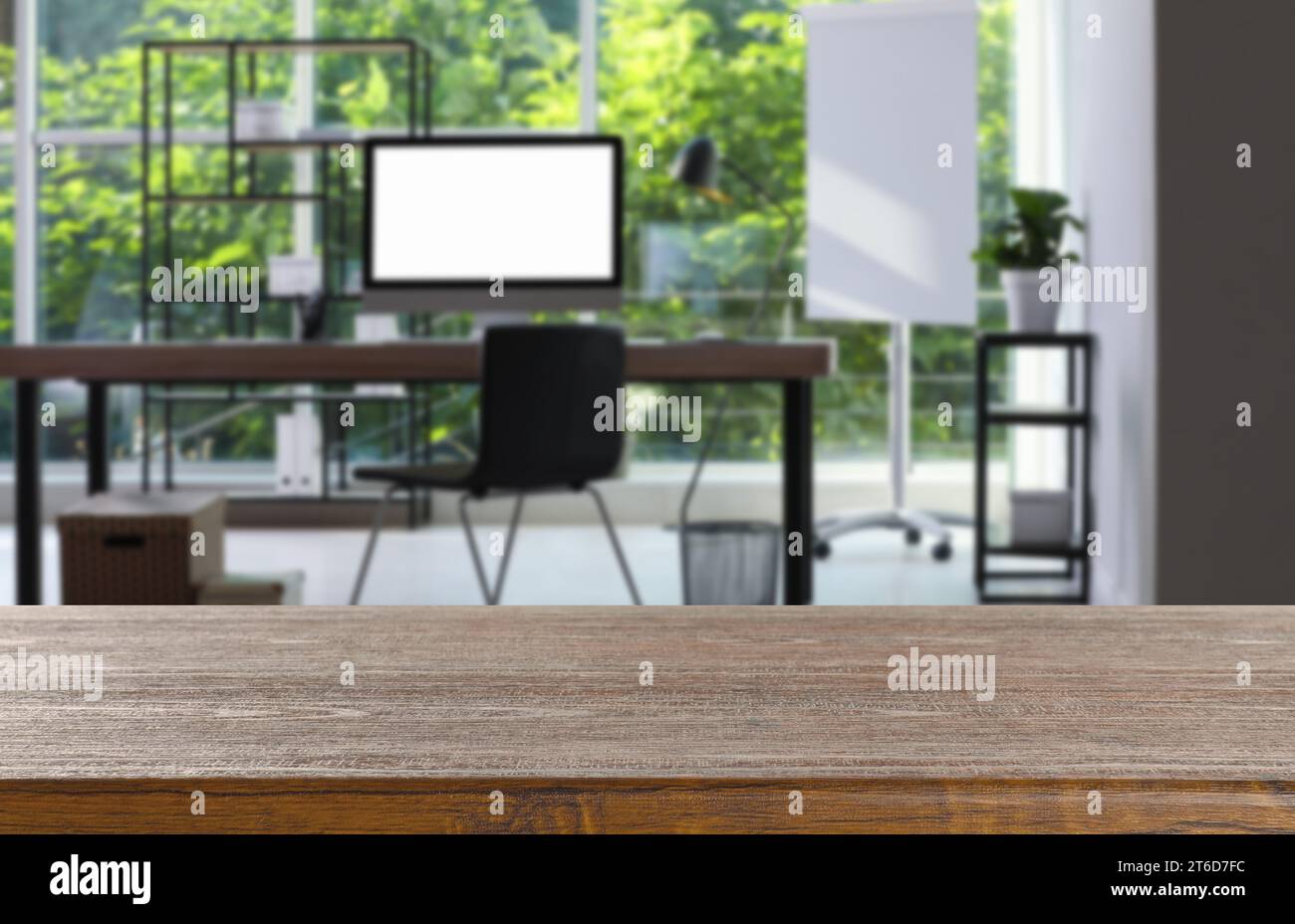Empty wooden table in comfortable office. Space for design Stock Photo ...