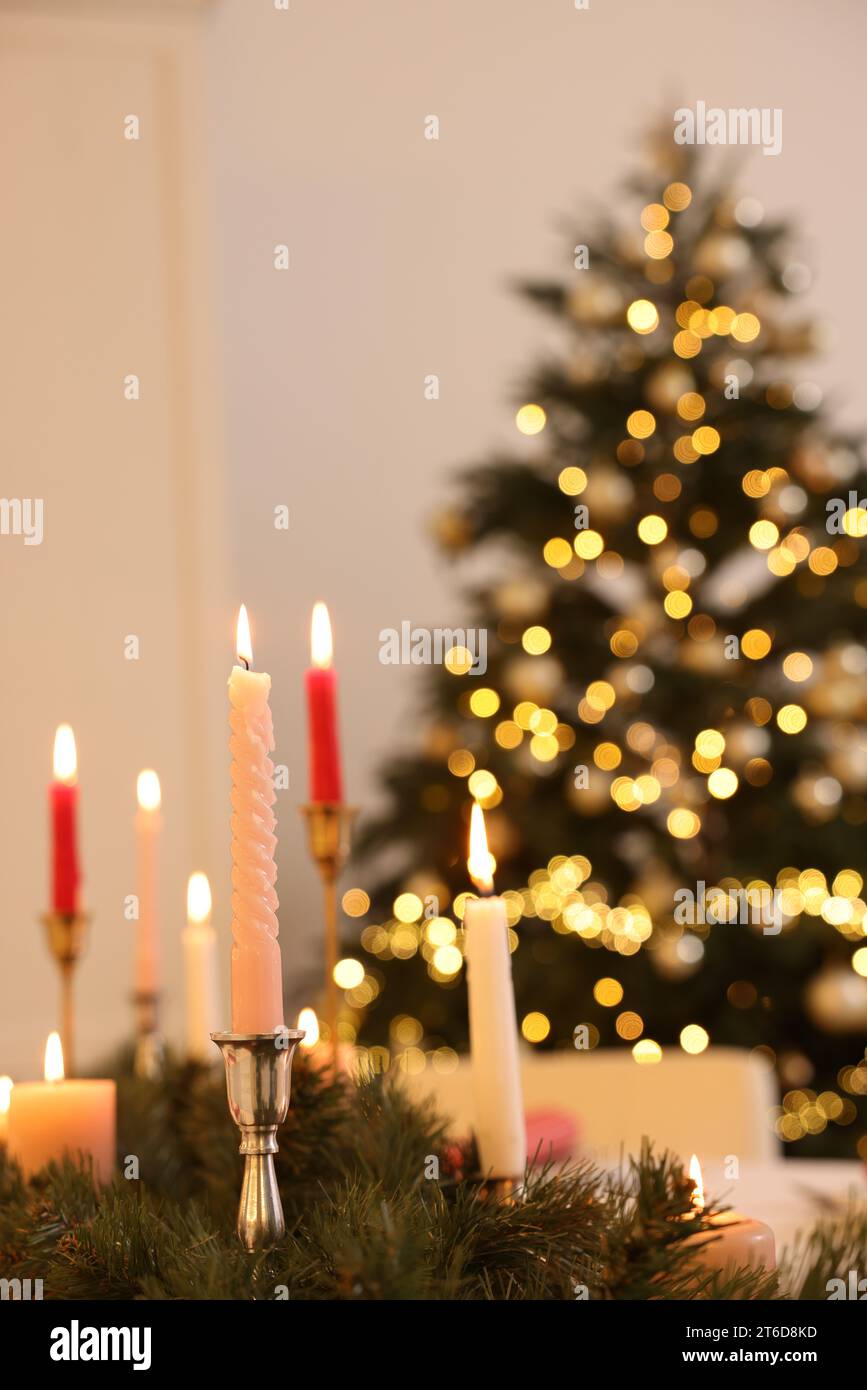 Festive table setting and beautiful Christmas decor in room. Interior ...
