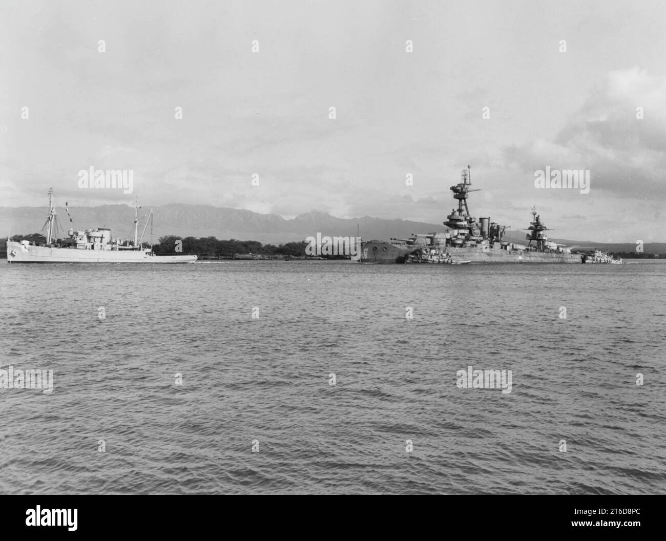 USS Conserver (ARS-39) tows USS New York (BB-34) out of Pearl Harbor to ...