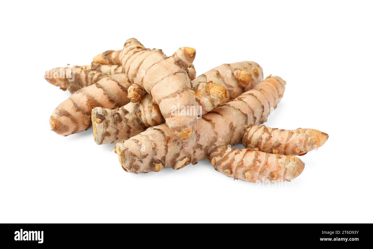 Fresh whole turmeric roots isolated on white Stock Photo - Alamy