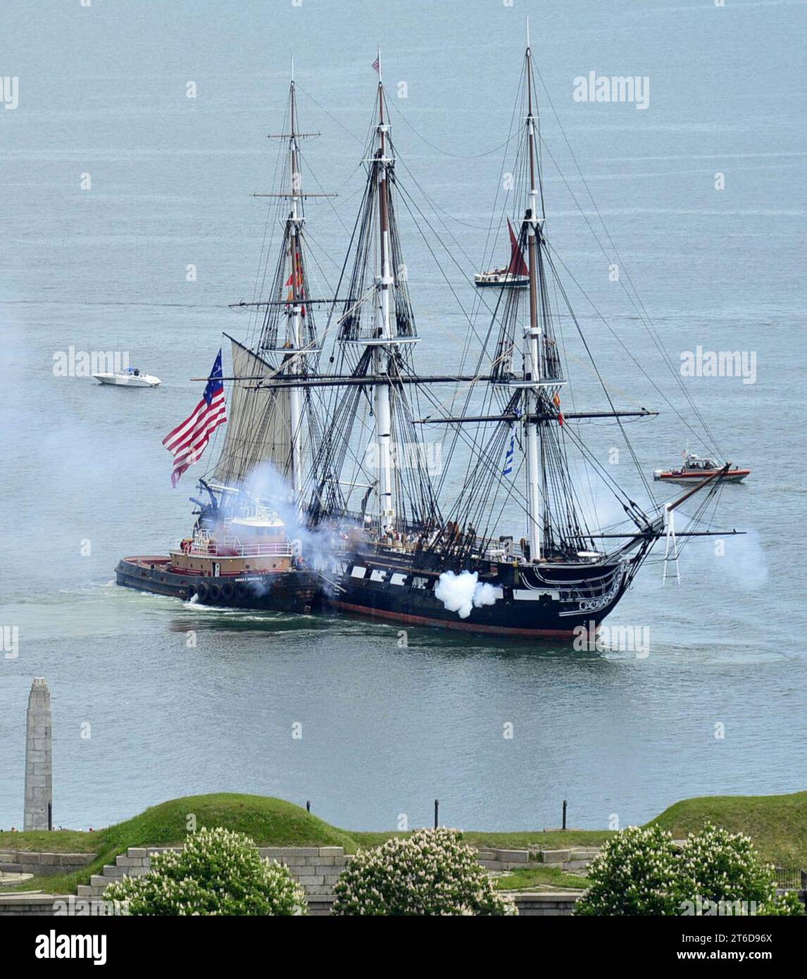 USS Constitution fires its cannons as it is tugged through Boston ...